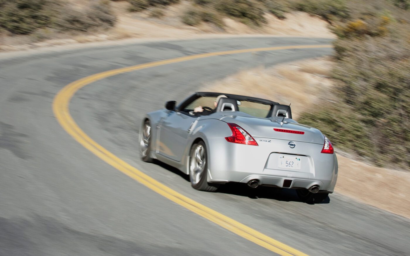 2010-nissan-370Z-roadster-rear-three-quarters-in-motion | | SuperCars.net